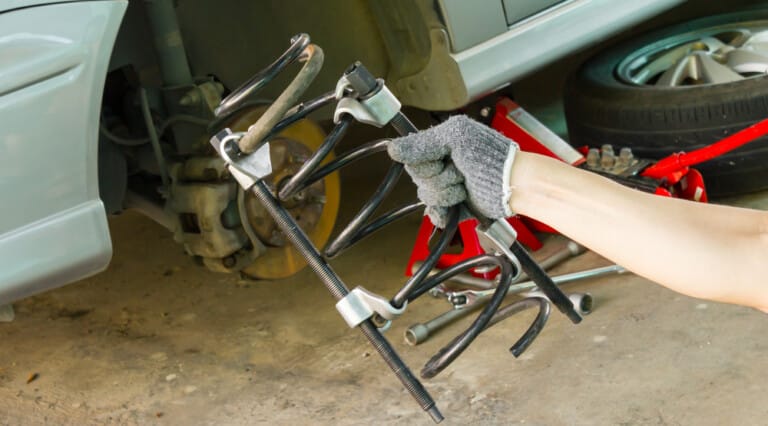 5 Symptoms Of A Broken Coil Spring And Replacement Cost