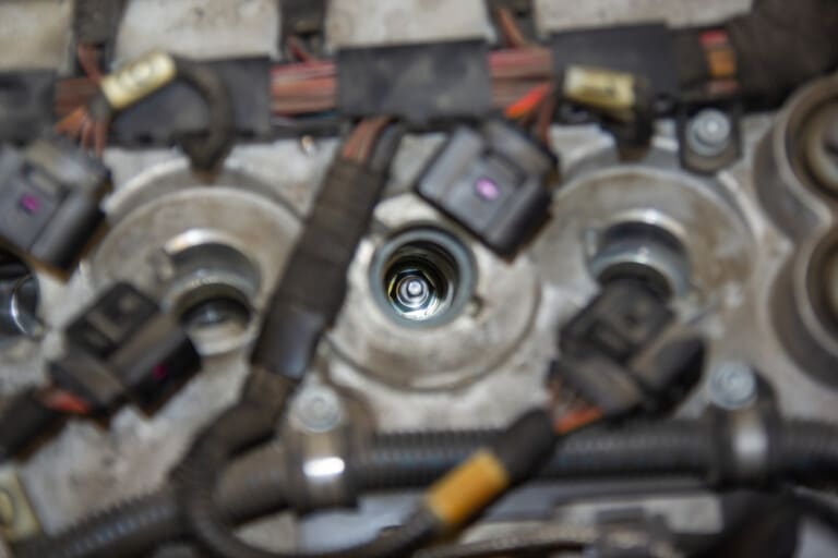 7 Symptoms Of Bad Spark Plugs & Replacement Cost