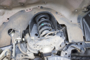 5 Symptoms Of A Broken Coil Spring & Replacement Cost
