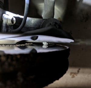 Car Makes A Squeaking Noise While Driving But Not When Brakes Are Applied?